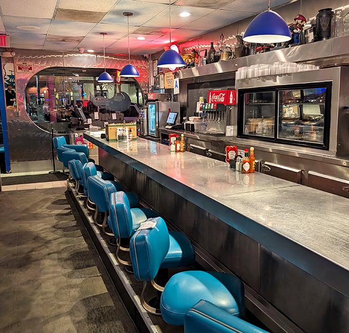 Those turquoise stools have witnessed more breakfast epiphanies than a morning talk show – each one a throne of satisfaction.