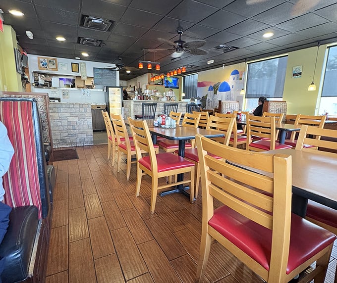 Warm wooden chairs with cherry-red cushions invite you to settle in for the long haul. This isn't fast food—it's food worth savoring.