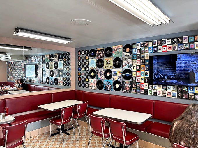 Red vinyl booths and walls adorned with vintage records—this isn't decoration, it's a full-immersion therapy session for the soul.