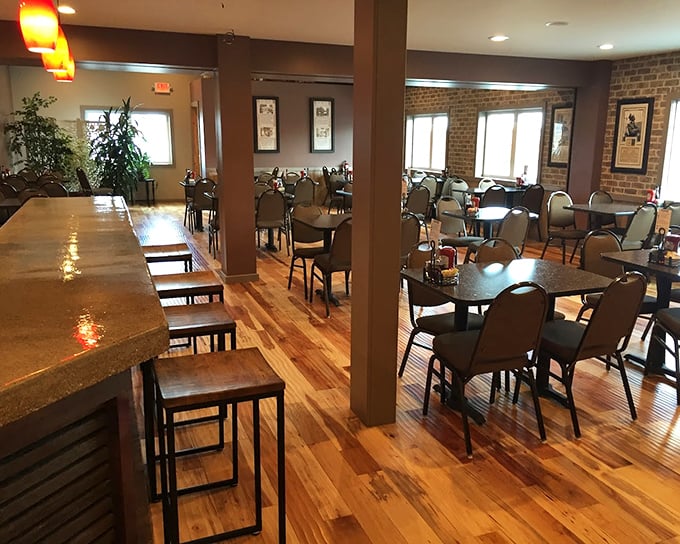 Warm wood floors and comfortable seating create that rare atmosphere where lingering over coffee feels like a constitutional right.