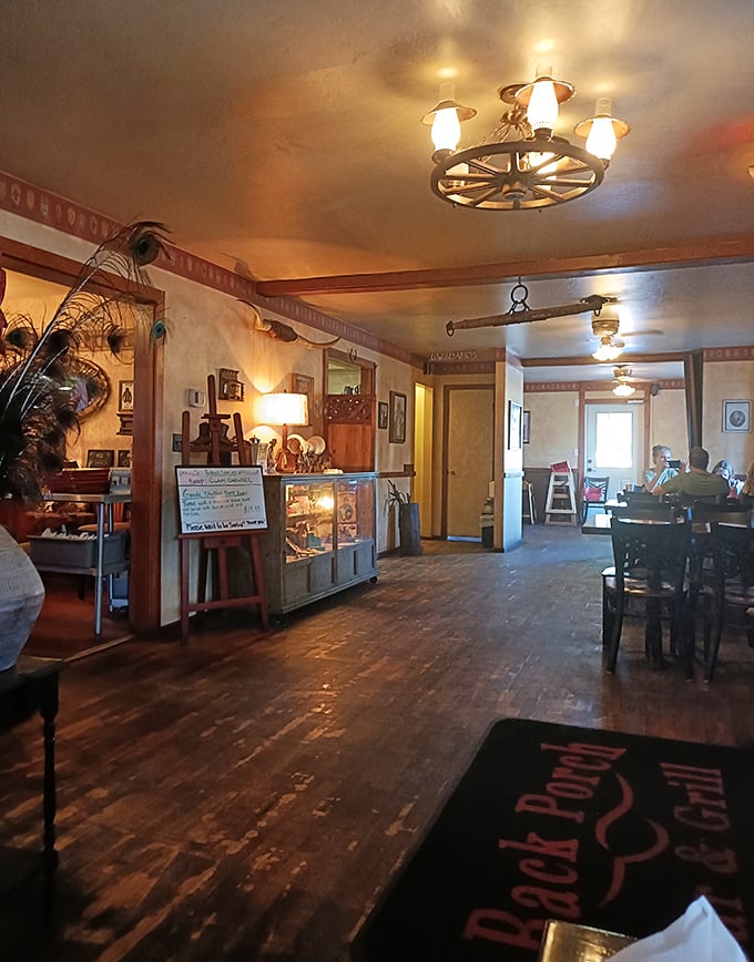 Step inside to worn wooden floors and wagon wheel chandeliers—where every creak tells a story of satisfied diners who came before you.