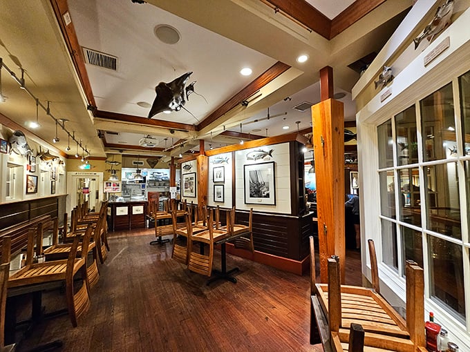 Warm wooden tones and nautical touches transform this dining room into a sailor's dream, where every seat promises both comfort and maritime charm.