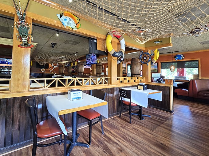 Step inside a quirky nautical-themed eatery where ship wheels, lifebuoys, and playful décor create a seaside escape far from the water.
