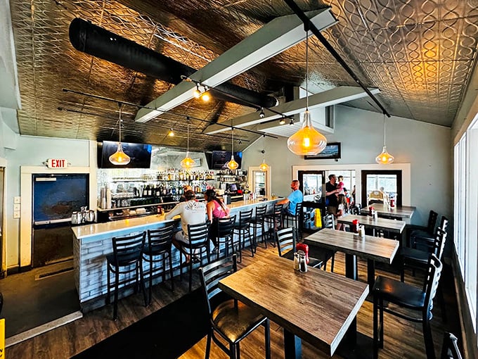 That pressed tin ceiling isn't just for show—it's bouncing the sounds of happy diners discovering why locals keep this place packed year-round.
