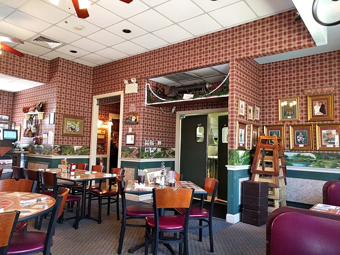 Red checkered walls, wooden chairs, and train-themed décor create that perfect "I've discovered somewhere special" atmosphere that makes you want to become a regular.