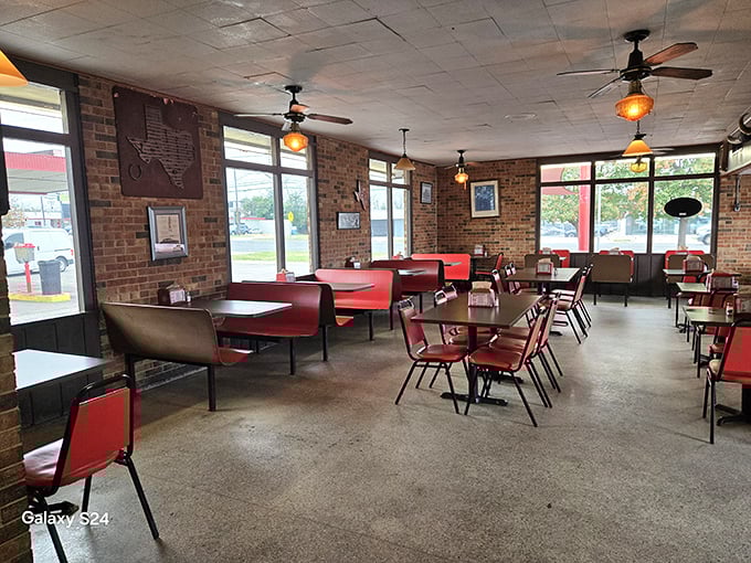 Red vinyl booths, brick walls, and ceiling fans spinning lazily overhead – stepping into Top Notch feels like time travel with the delicious bonus of charcoal-grilled burgers.