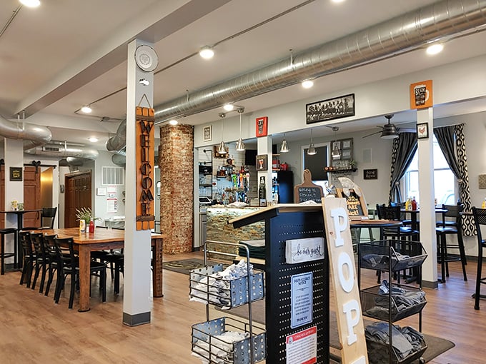 Inside, exposed ductwork meets warm wood floors in a space that feels both modern and comfortably Midwestern—like your coolest friend's renovated loft.