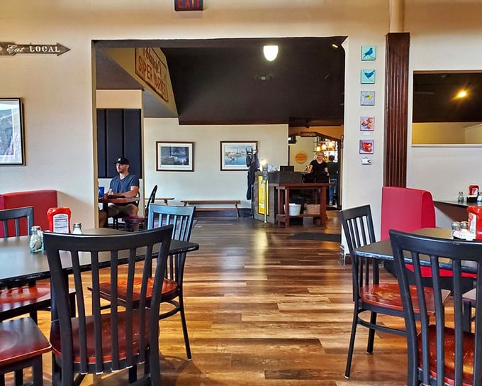 Warm wooden floors, comfortable seating, and that "Eat Local" sign that isn't just decoration—it's a delicious promise The Tilted Skillet delivers on daily.
