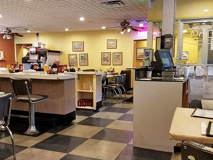 Classic black and white tiles, cozy booths, and counter seating – this isn't retro design, it's simply never gone out of style.
