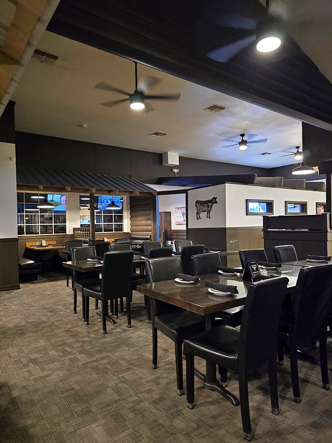 Dark wood, leather chairs, and that iconic steer silhouette—this isn't just a dining room, it's a temple to the art of beef.
