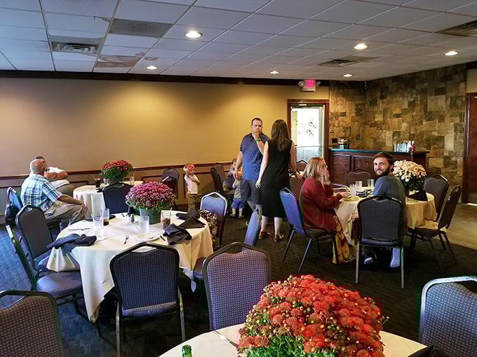 Family gatherings unfold amid seasonal flowers and white tablecloths, creating that perfect sweet spot between "special occasion" and "feels like home."