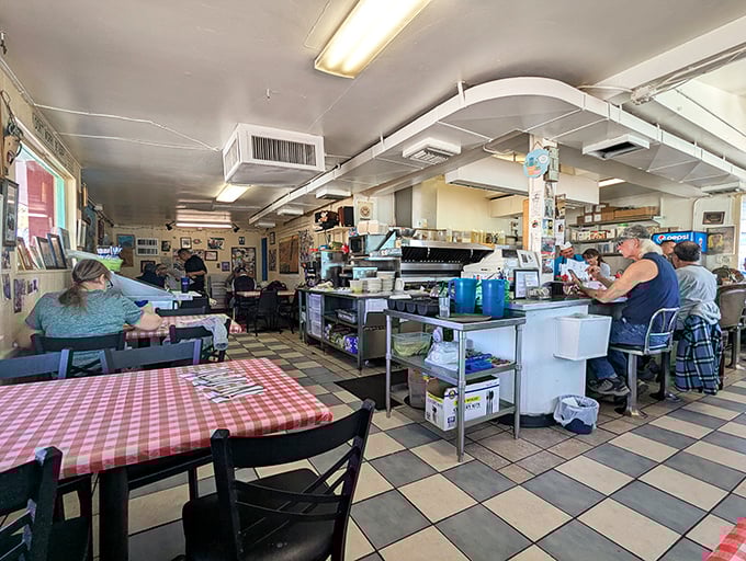 Inside Frank's, the checkered floor and open kitchen create the perfect diner atmosphere – where breakfast dreams come true and coffee cups never empty.