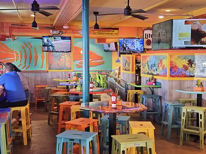 A kaleidoscope of colorful stools and marine-inspired murals creates the perfect casual vibe—because serious food doesn't need serious furniture.