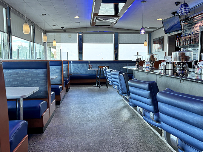 Blue vinyl booths and counter seating create that perfect "everybody knows your name" atmosphere where coffee refills appear like magic.