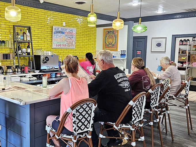 That vibrant yellow brick wall isn't just a design choice—it's a beacon of breakfast hope for hungry patrons perched at the counter.