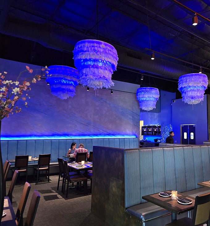 Step inside and the blue-hued interior with feathery chandeliers creates an atmosphere that's both sophisticated and playful—fine dining without the stuffiness.