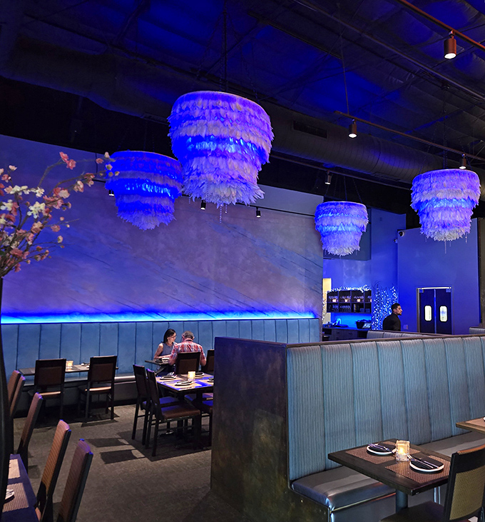 Step inside and the blue-hued interior with feathery chandeliers creates an atmosphere that's both sophisticated and playful—fine dining without the stuffiness.