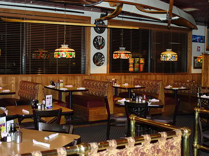 Stained glass lamps cast a warm glow over wood-paneled booths, creating that perfect "everybody knows your name" vibe without the bar tab.