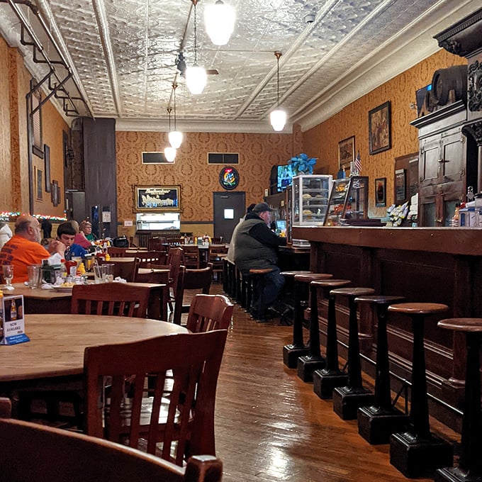 Step inside and you're transported to another era—pressed tin ceilings, amber walls, and wooden floors that have stories to tell.