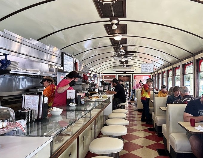 Step inside and you're transported to the golden age of American diners—red and white checkerboard floors, curved ceiling, and counter seating where strangers become friends over coffee.