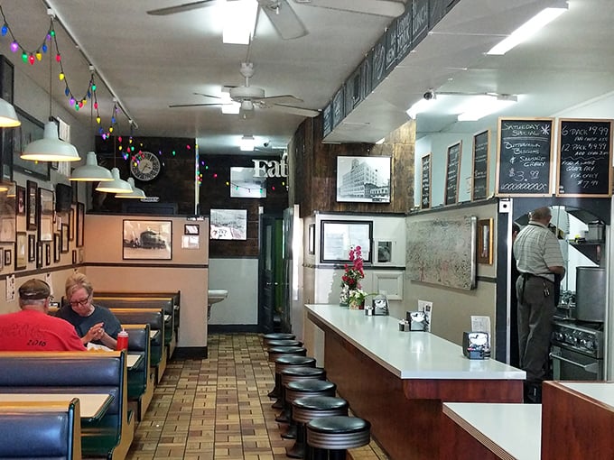 Inside, time stands still in the best possible way. Counter stools await regulars while vintage photos whisper stories of Erie's past.