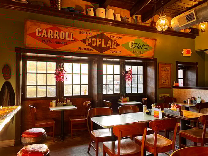 Vintage charm meets cozy comfort inside Honey's, where the Carroll Poplar sign reminds you that good things happen in buildings with history.