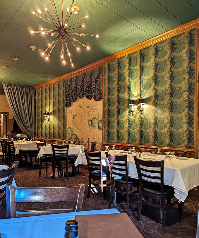 Mid-century elegance meets timeless comfort. Those seafoam green drapes and sputnik chandelier aren't retro—they're original. This room has witnessed more celebrations than a wedding DJ.