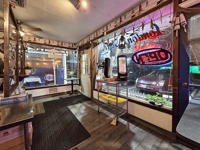 Step inside and the nautical theme welcomes you like an old sea captain's quarters. The neon "OPEN" sign might as well say "Abandon diet, all ye who enter here."