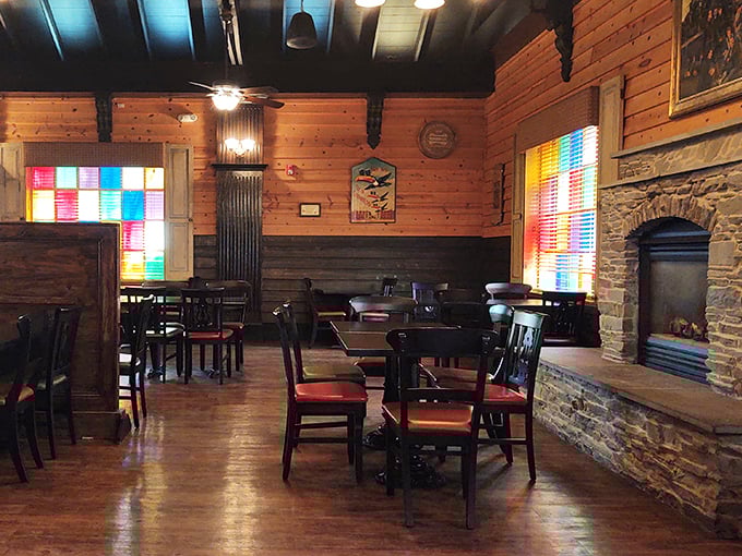 Warm wooden paneling, colorful stained glass, and a stone fireplace create the perfect setting for comfort food that hugs your soul.