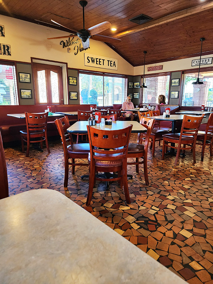 Wooden ceiling, mosaic floors, and "Sweet Tea" signs—this isn't interior design, it's a time machine to when conversations happened face-to-face.