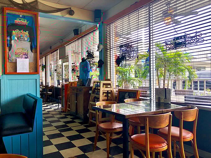 Classic Florida charm comes alive with turquoise paneling and checkered floors – the kind of authentic beach joint where memories are made between bites. 