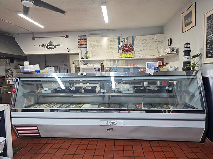 The seafood display case – where dreams and dinner plans collide. Like a jewelry counter, but the gems are edible and significantly more satisfying than diamonds.