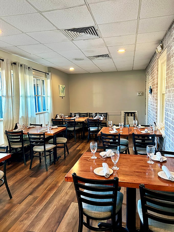 Warm wood tones and exposed brick walls create that rare dining atmosphere—elegant enough for special occasions but comfortable enough for Tuesday night cravings.