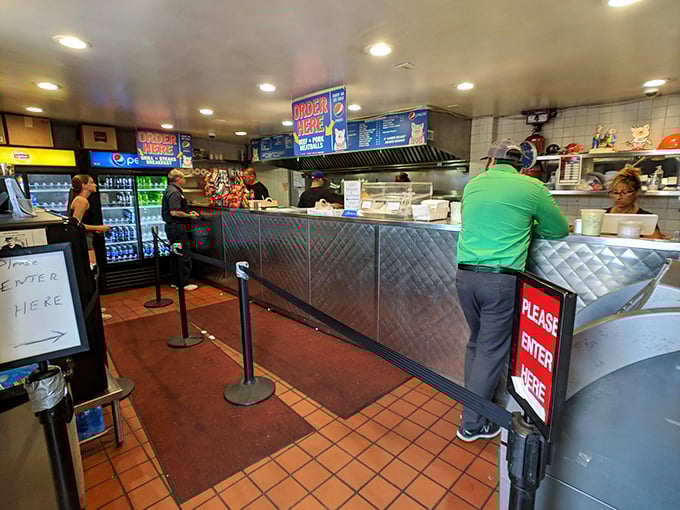 No fancy frills here—just the serious business of sandwich-making happening behind that stainless steel counter. The anticipation in line is part of the experience.
