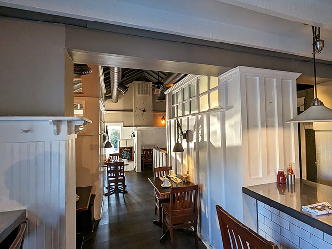 That classic diner corridor view—where every table feels like the best seat in the house and breakfast dreams come true just beyond those white walls.