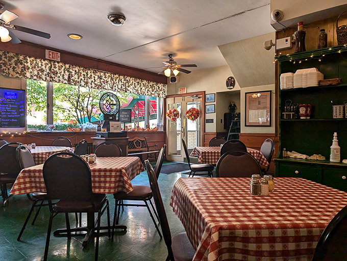 Red and white checkered tablecloths aren't a trendy design choice here—they're the authentic canvas upon which generations of memorable meals have been served.