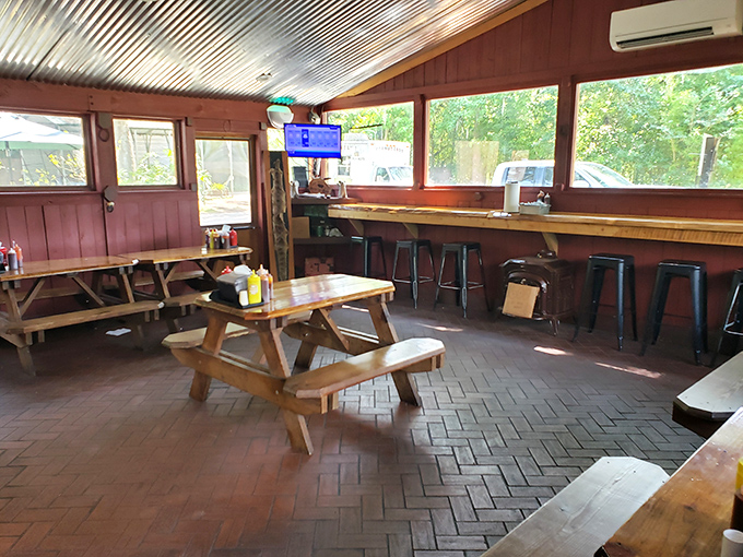 Picnic tables, corrugated metal ceiling, and zero pretension. This isn't dining theater—it's BBQ church, where the only dress code is bringing your appetite.