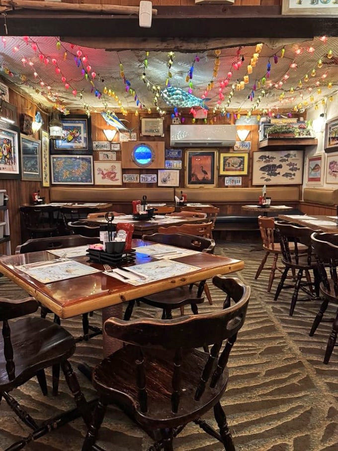 Christmas meets the Caribbean year-round inside, where colorful string lights dance across the ceiling above walls adorned with license plates and marine artwork.