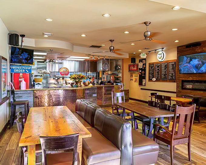 Wooden tables, leather booths, and copper accents create the perfect backdrop for fried chicken revelations. Casual elegance meets comfort food paradise.