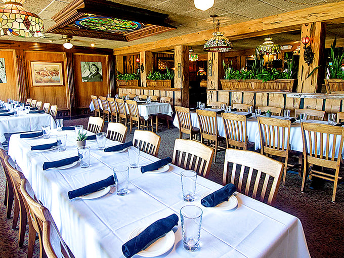 Tiffany lamps cast a warm glow over white tablecloths, creating that rare atmosphere where you can celebrate anniversaries or simply Tuesday night.