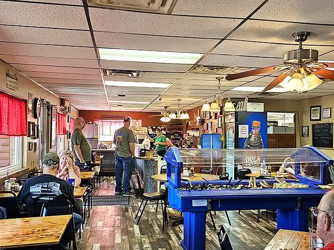 Inside, wooden tables and ceiling fans create the perfect small-town atmosphere where conversations flow as freely as the coffee. No designer needed—this is authentic Americana.