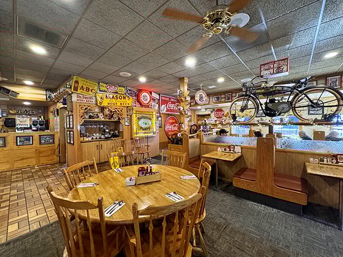 Step inside and time-travel to simpler days. Vintage signs, wooden booths, and yes, that's an actual bicycle suspended from the ceiling—because why not?