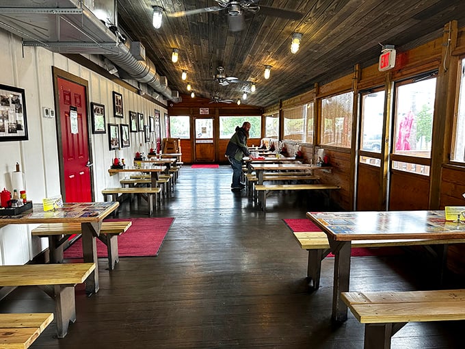 Step inside and time slows down – wooden benches, plank floors, and ceiling fans spinning stories of countless seafood feasts shared among friends.