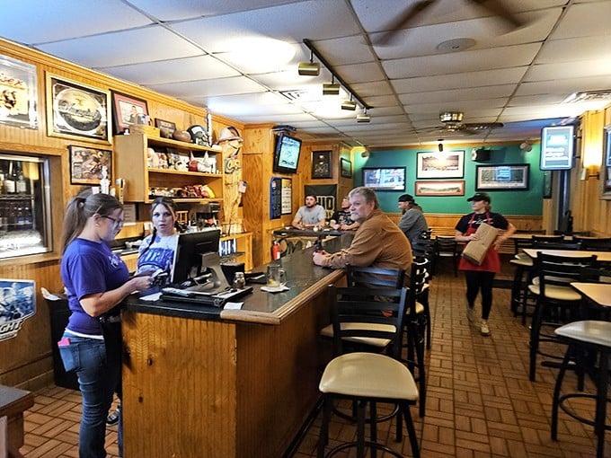 Inside, wood-paneled walls and a welcoming counter create that perfect small-town pizzeria vibe where everybody might not know your name yet, but they're about to.
