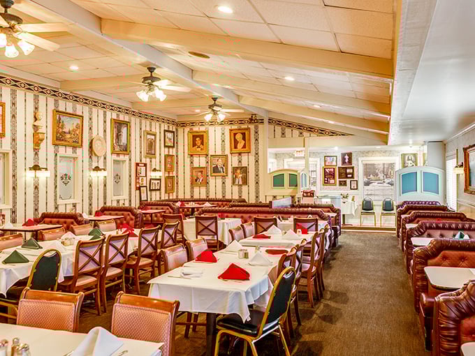 Step inside and you're transported to another era—family photos line striped wallpaper while red leather booths invite you to settle in for the long, delicious haul.