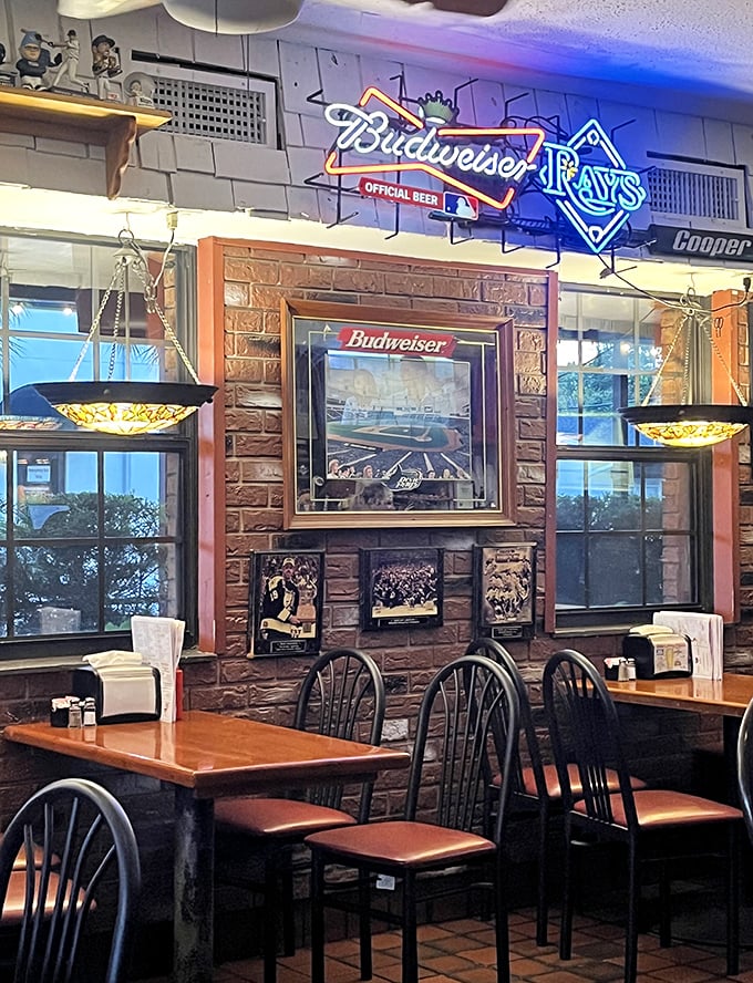 Sports memorabilia and Tiffany-style lamps create the perfect backdrop for burger bliss. This isn't décor—it's a time capsule of memories.