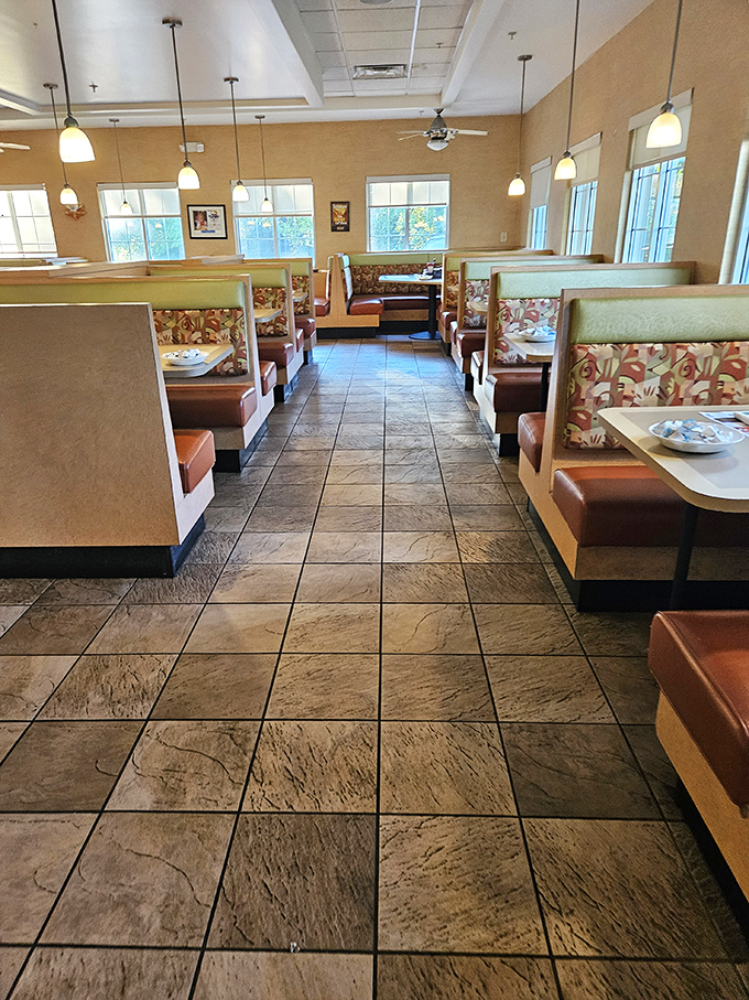 Cozy booths with floral upholstery invite you to slide in and stay awhile. The warm interior says, "Your diet can wait until tomorrow."