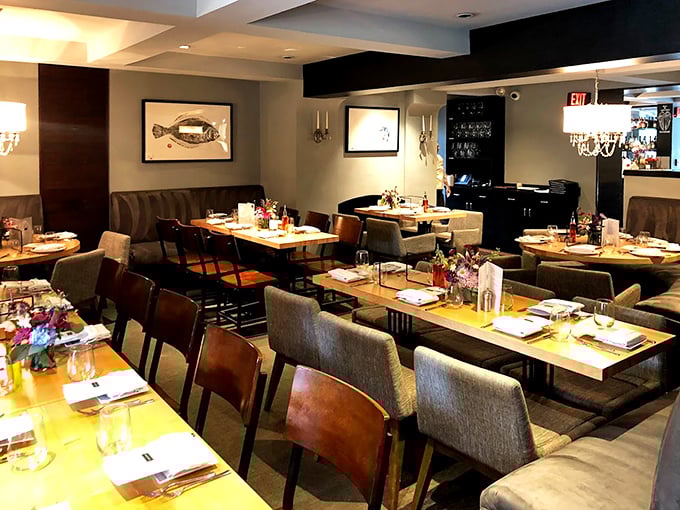 Where elegance meets comfort – notice the fish artwork subtly hinting at the seafood treasures awaiting your palate.
