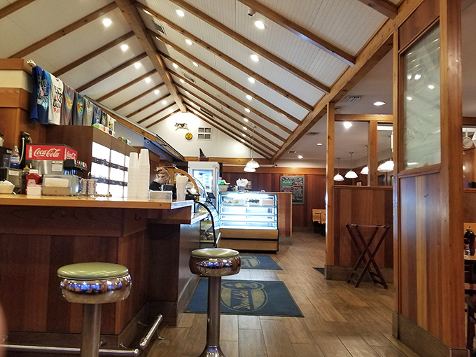 Step inside and you're greeted by warm wood paneling and classic counter seating. This isn't trendy minimalism—it's timeless comfort that says "stay awhile."