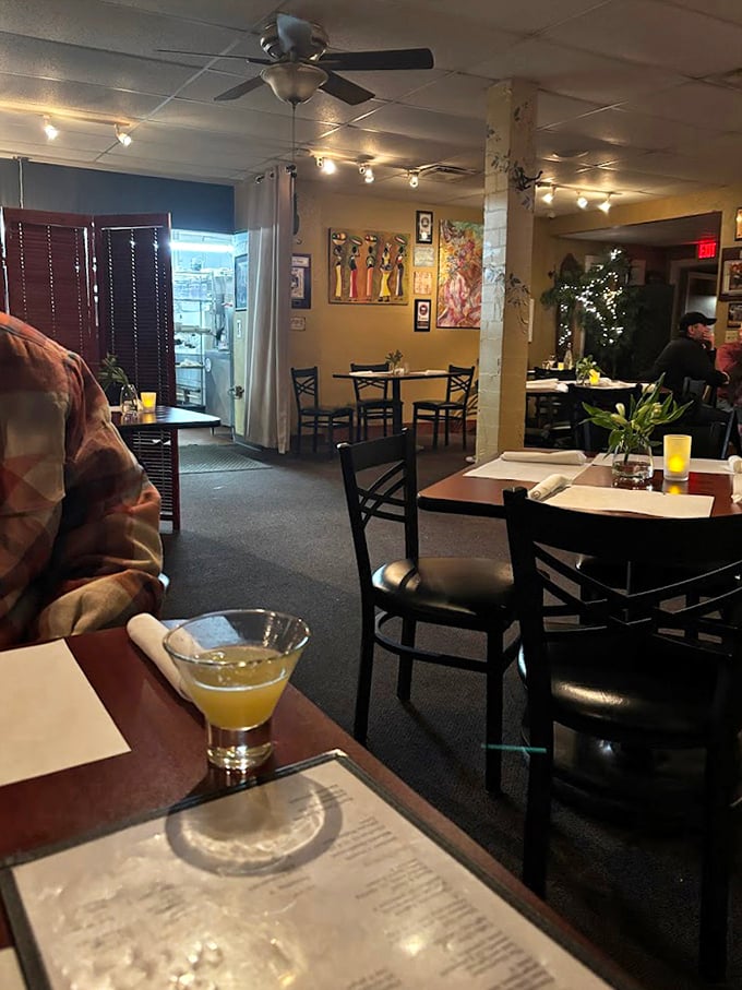 Inside, warm lighting and colorful artwork create that rare atmosphere where you immediately feel at home, yet know you're somewhere special.